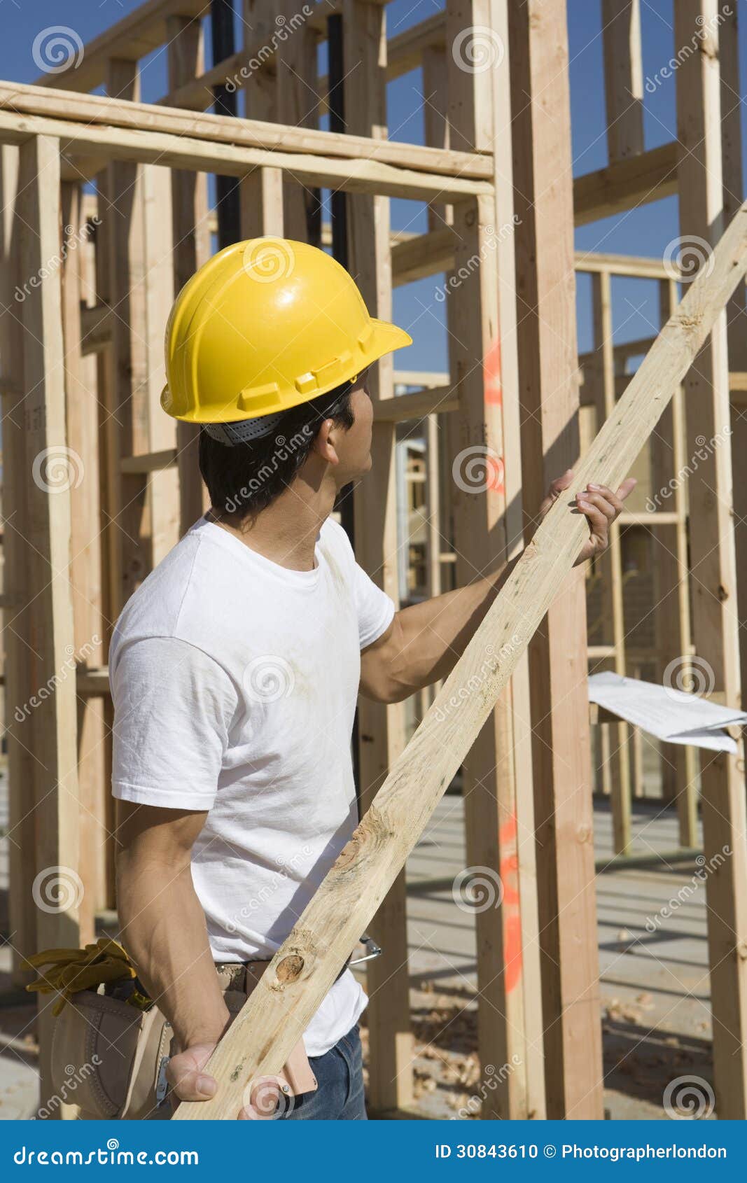 Construction Worker Holding Up Plank Stock Photo - Image of building ...