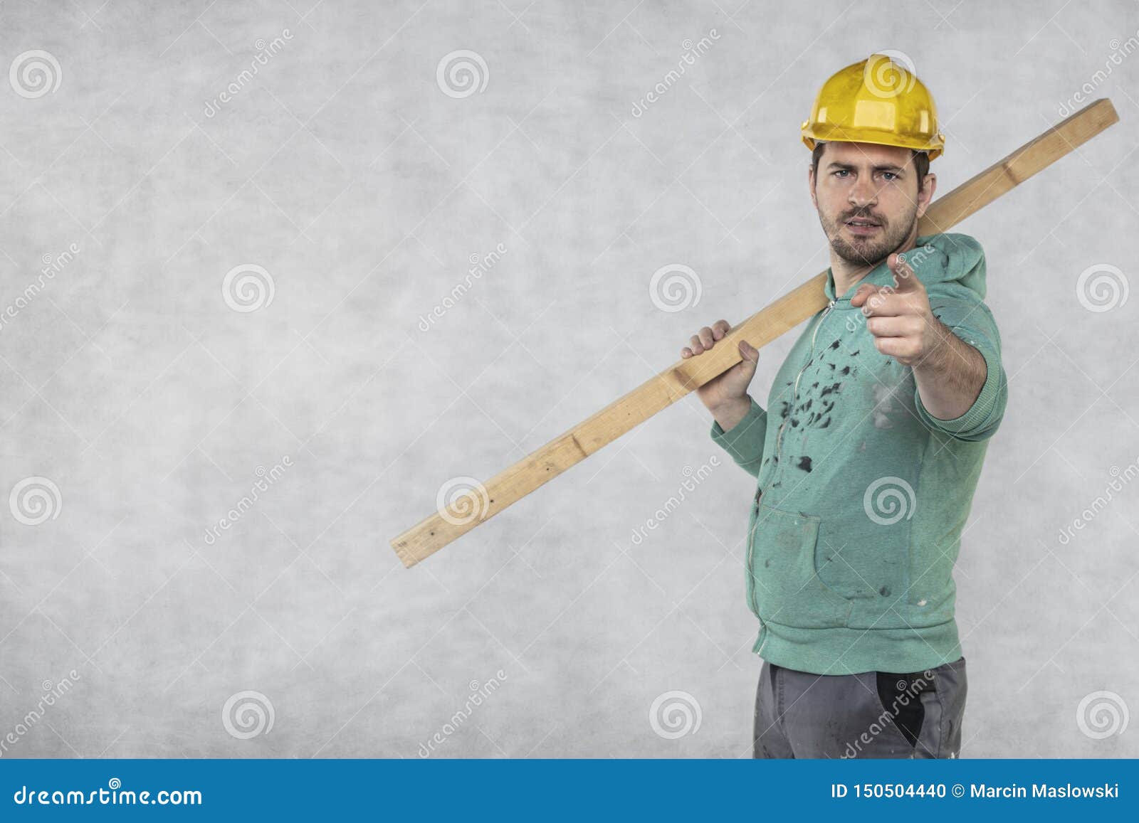 The Construction Worker Holds a Piece of Board in His Hands, the ...