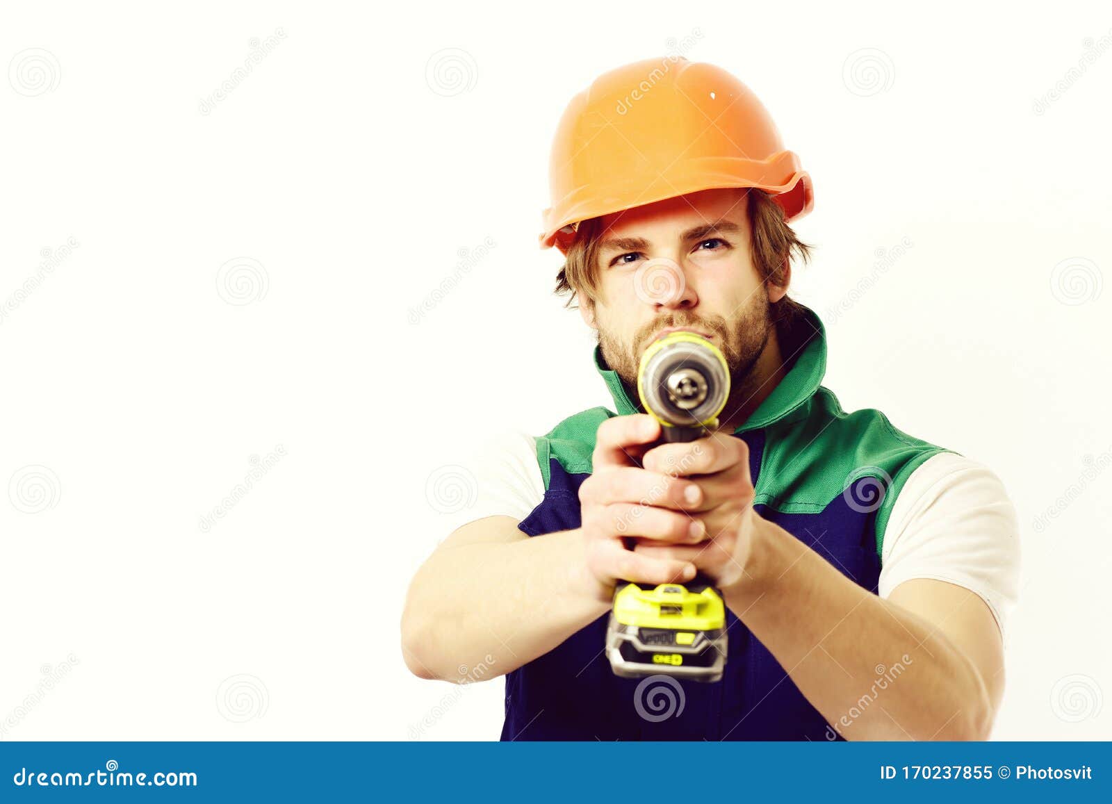 Construction Worker Holds Yellow Drill As Gun. Builder with Drill Stock ...