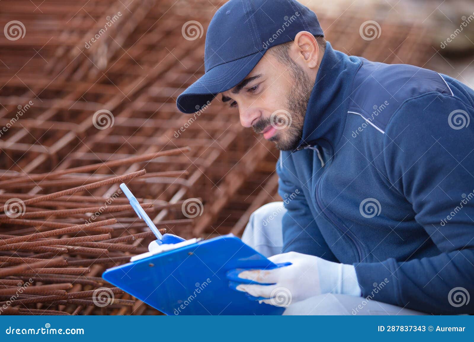 Construction Worker Inspecting Metal Bar Stock Image - Image of ...