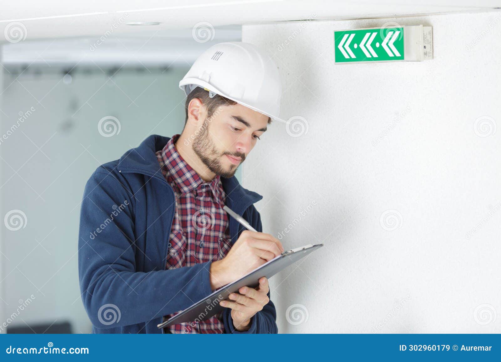 Construction Worker Inspecting Sign Stock Image - Image of indonesia ...