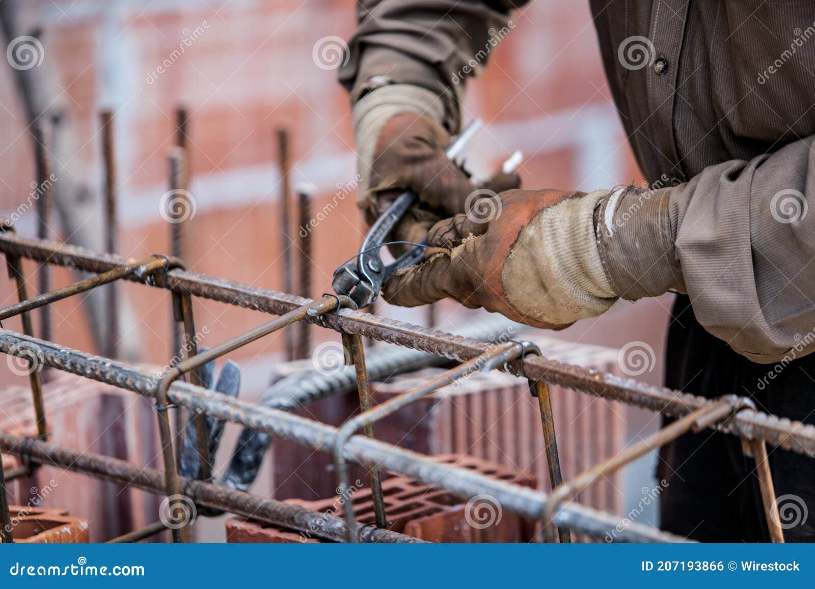 Construction Worker Installing Binding Wires on the Reinforcement Stock ...