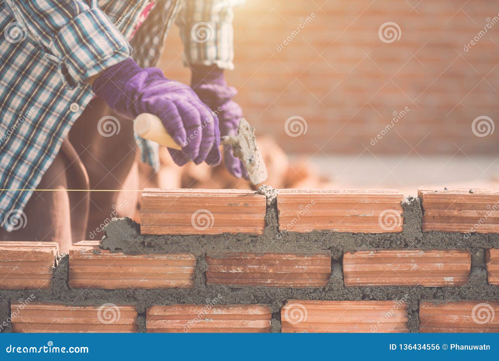 Worker Installing Bricks Wall in Process of House Building Stock Photo ...