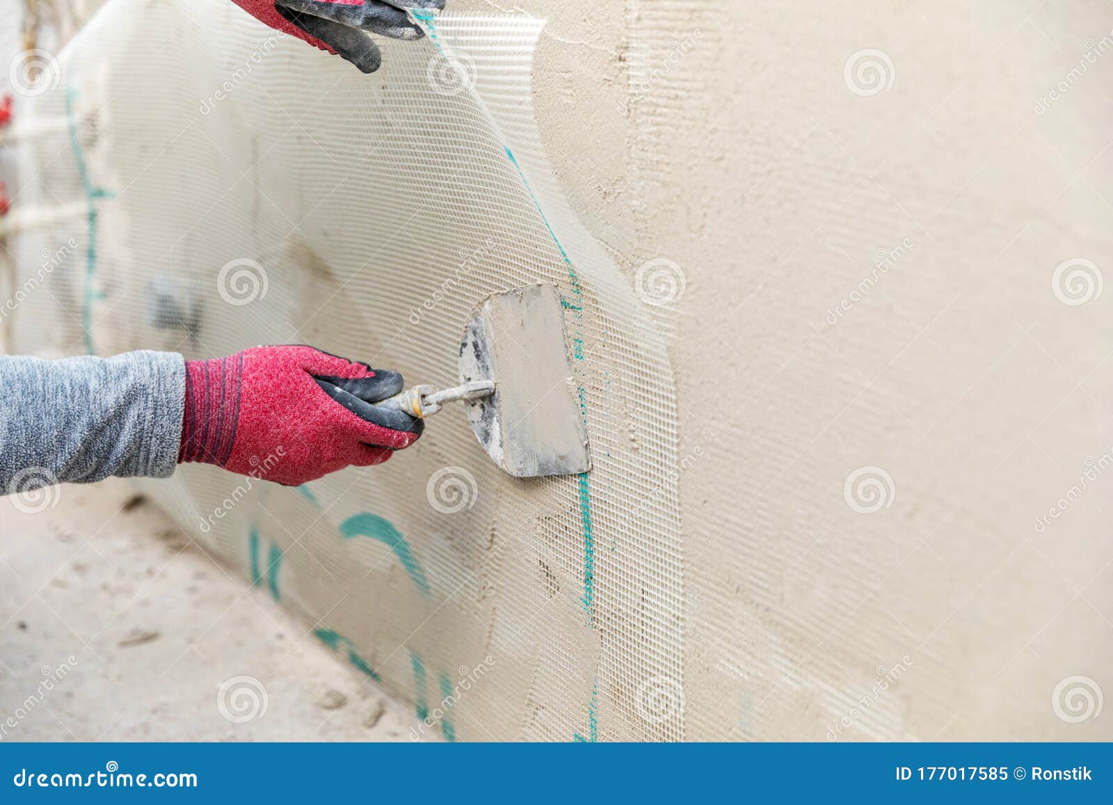 Construction Worker Installing Fiberglass Plaster Mesh on the Wall ...