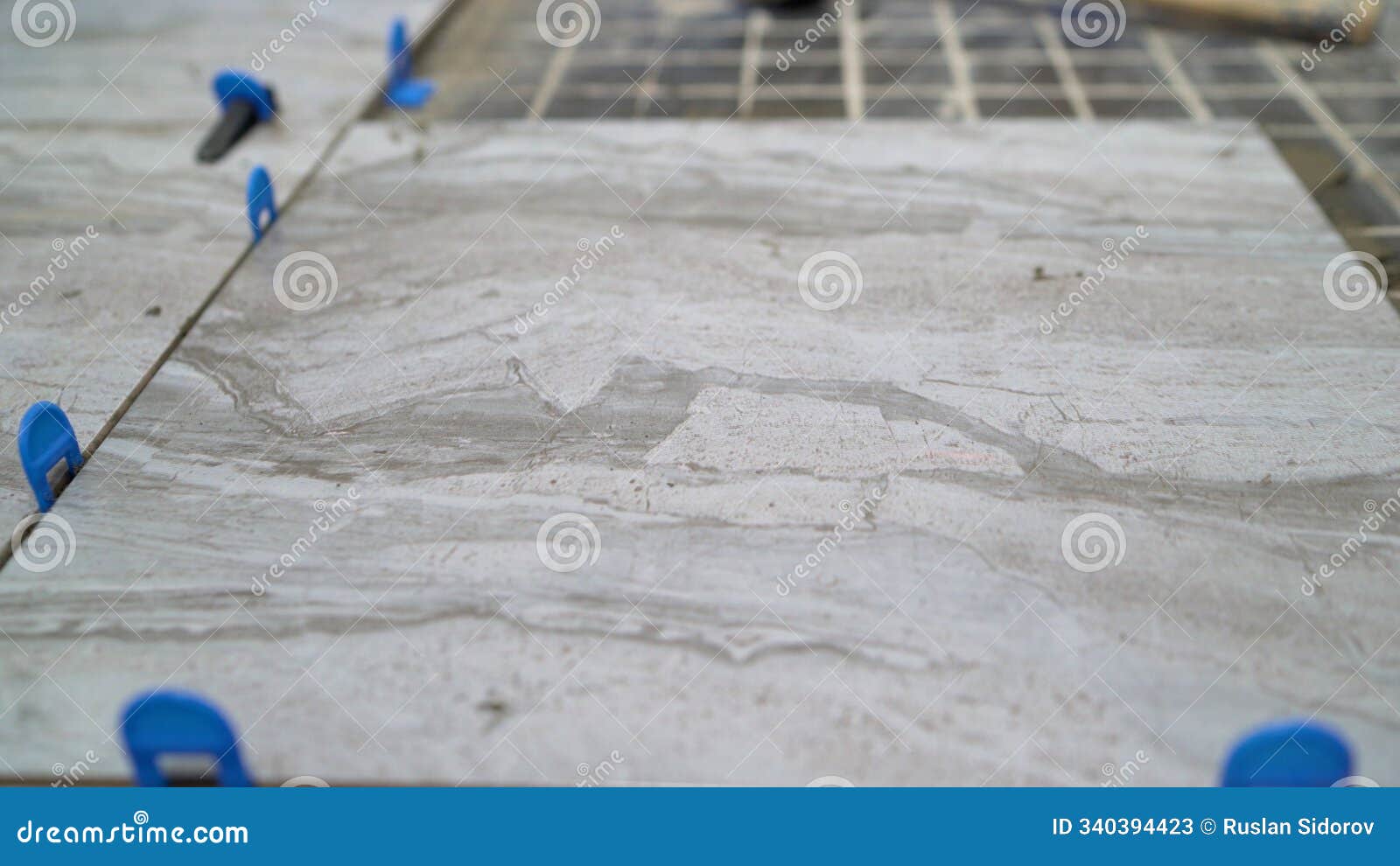 Worker Installing Large Ceramic Tiles with Leveling System. Stock Image ...