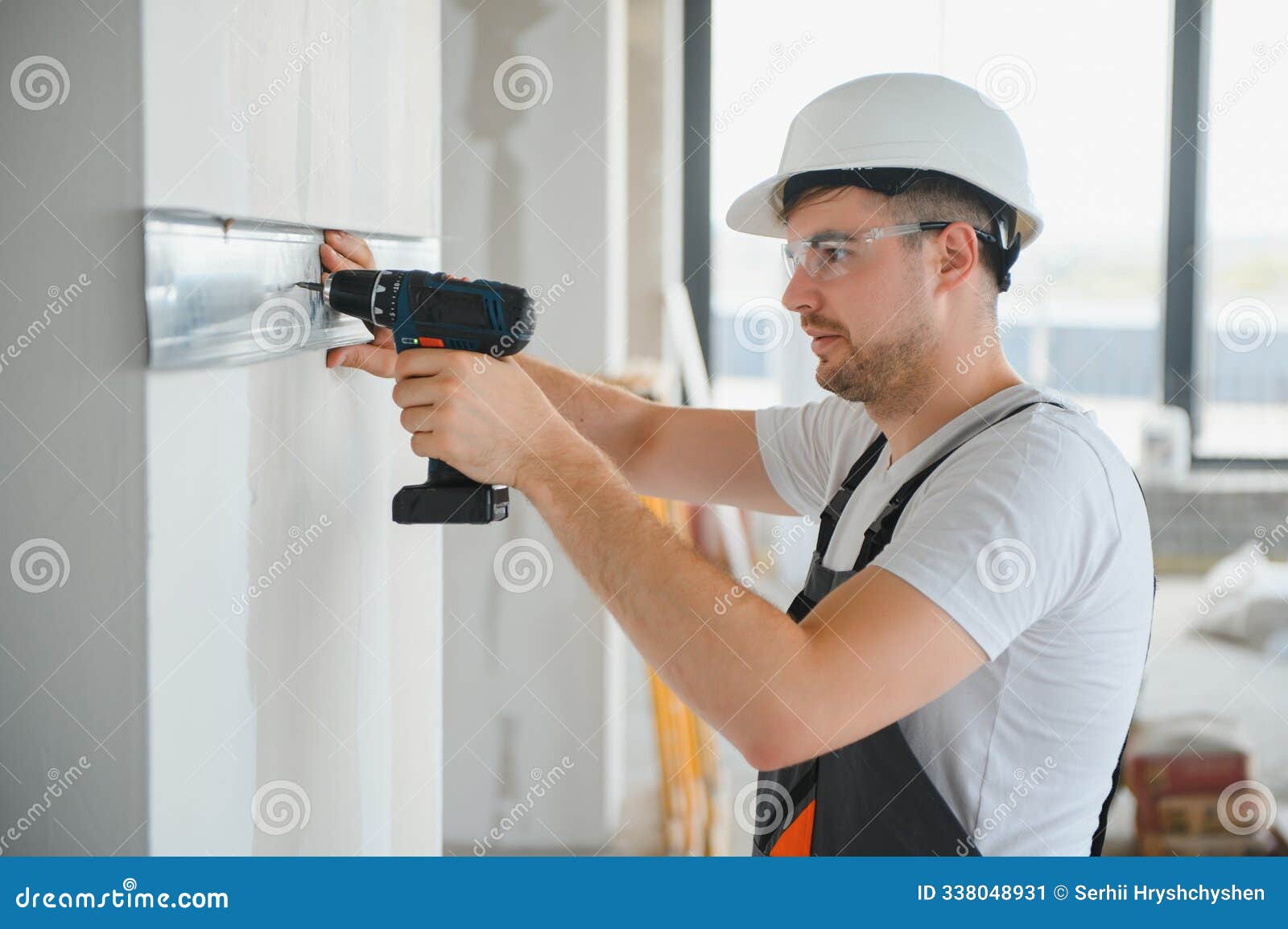 Construction Worker Installing Metal Profile for Interior Partition ...
