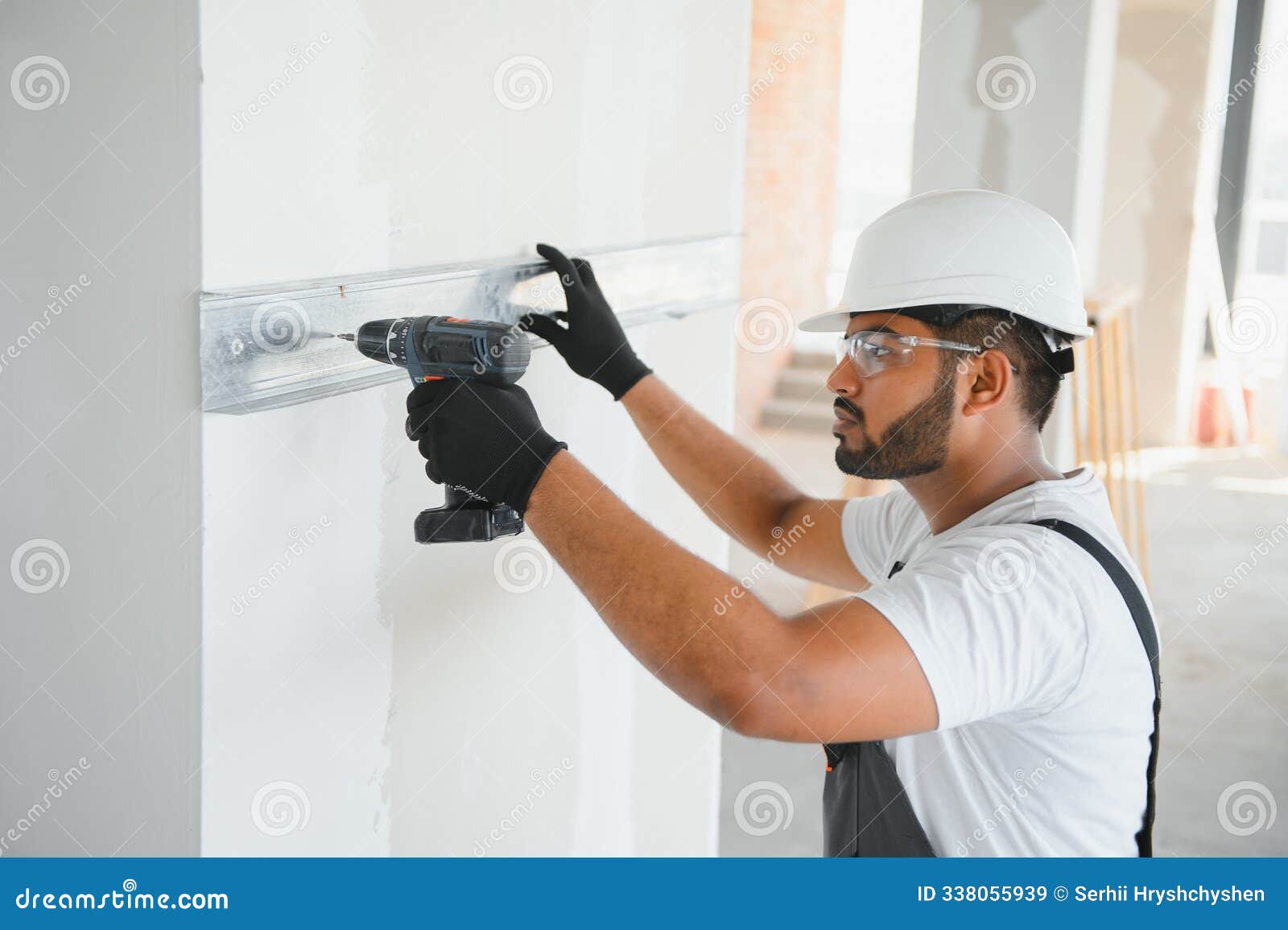 Construction Worker Installing Metal Profile for Interior Partition ...