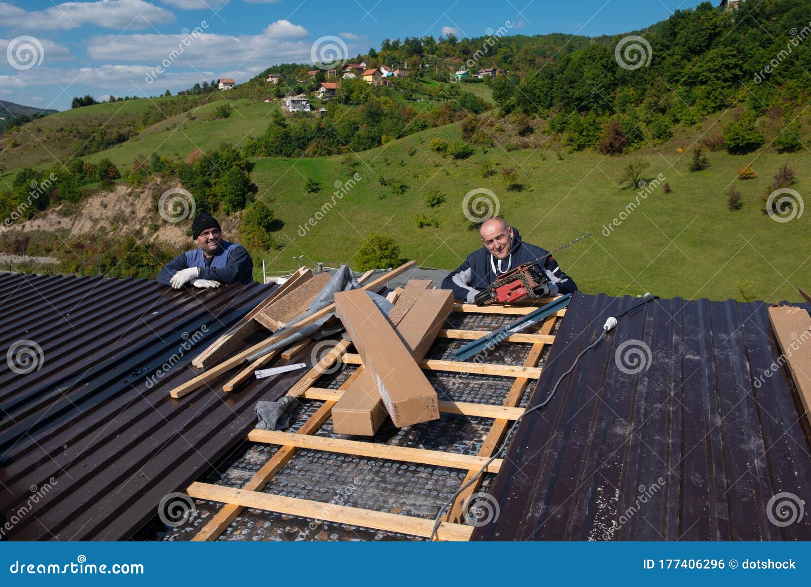 Construction Worker Installing a New Roof Stock Photo - Image of ...