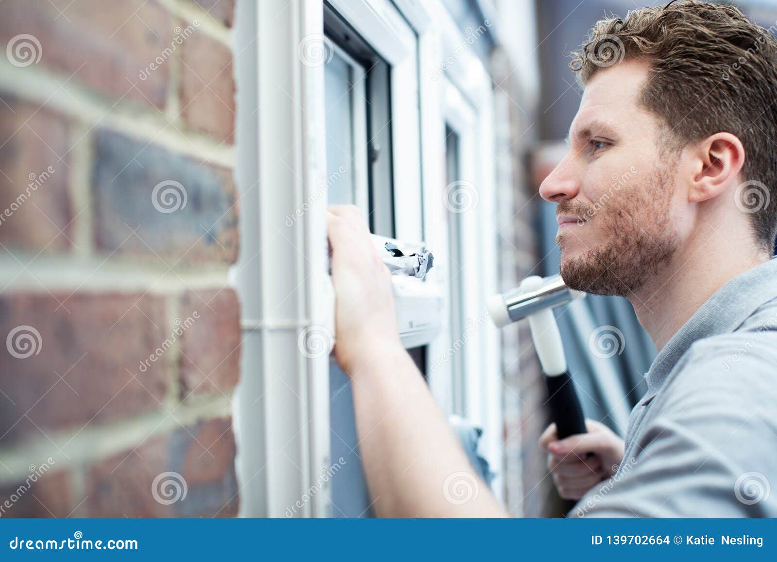 Construction Worker Installing New Windows in House Stock Photo - Image ...