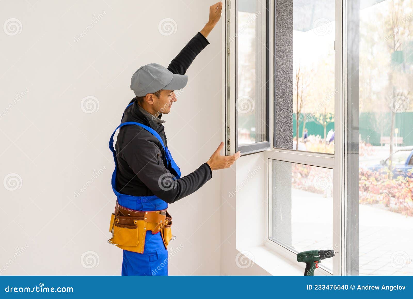Construction Worker Installing New Windows in House Stock Photo - Image ...