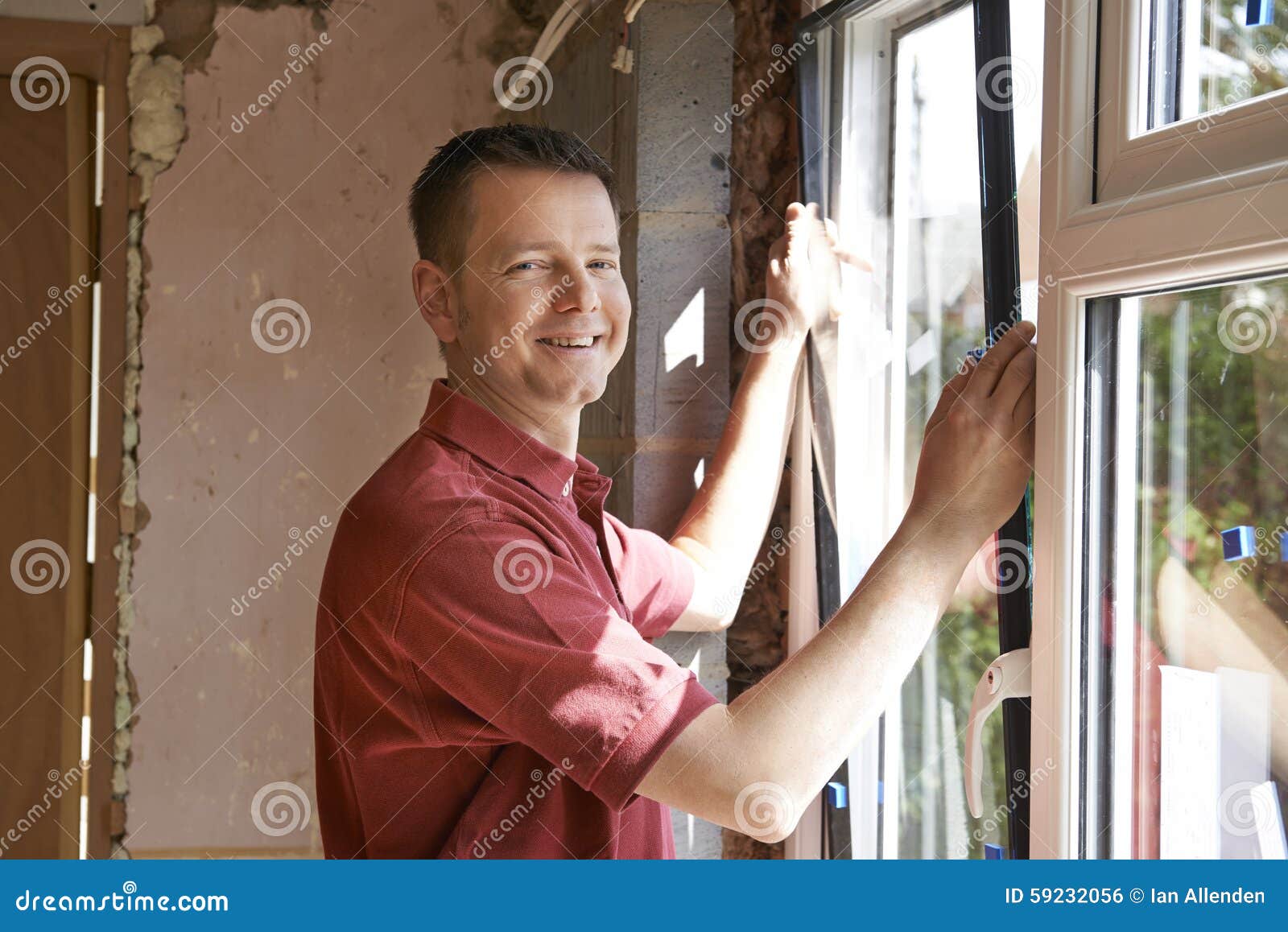 Construction Worker Installing New Windows in House Stock Photo - Image ...