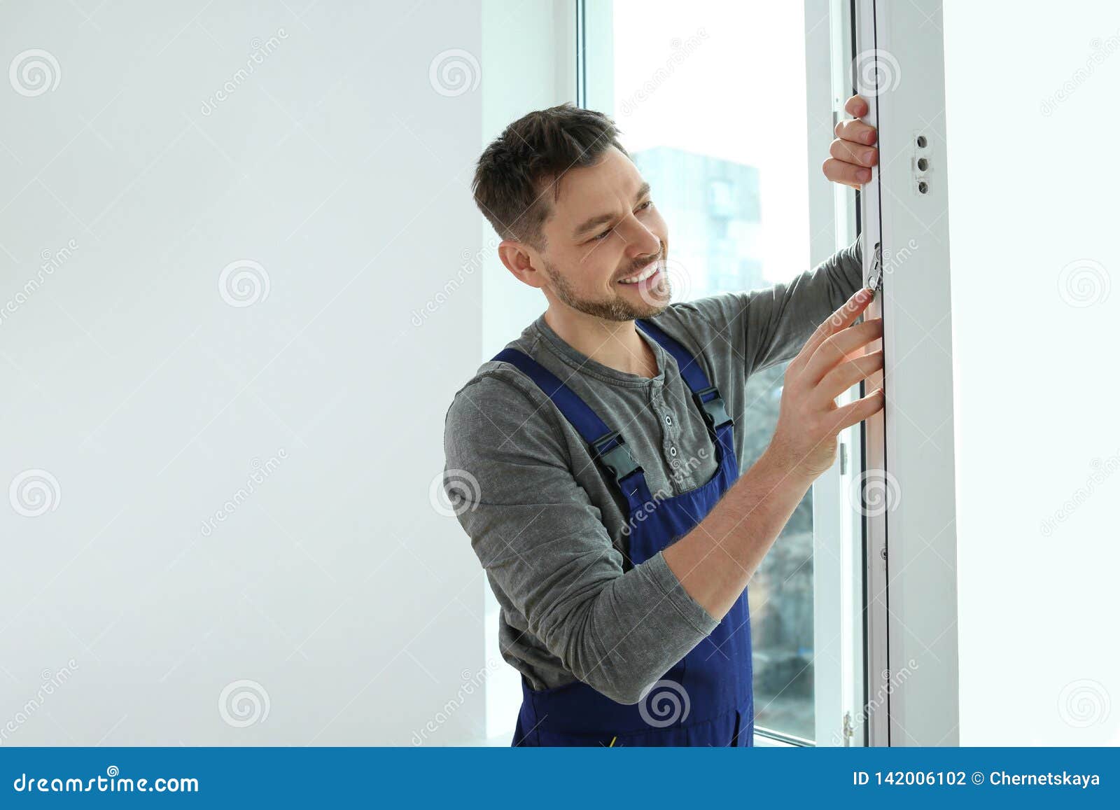Construction Worker Installing Plastic Window Stock Photo - Image of ...