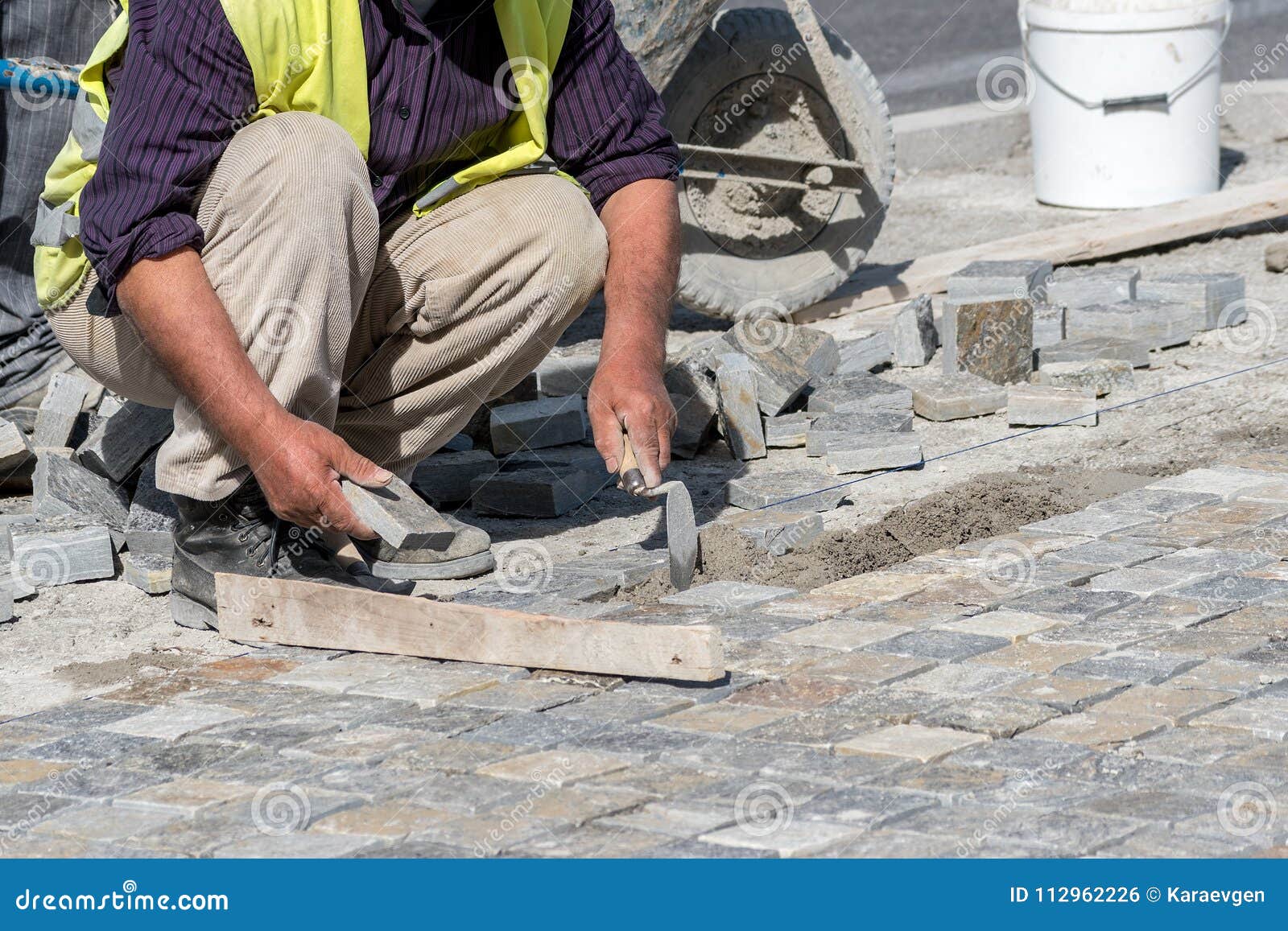 Construction Worker Installing Stone Blocks Stock Photo - Image of ...