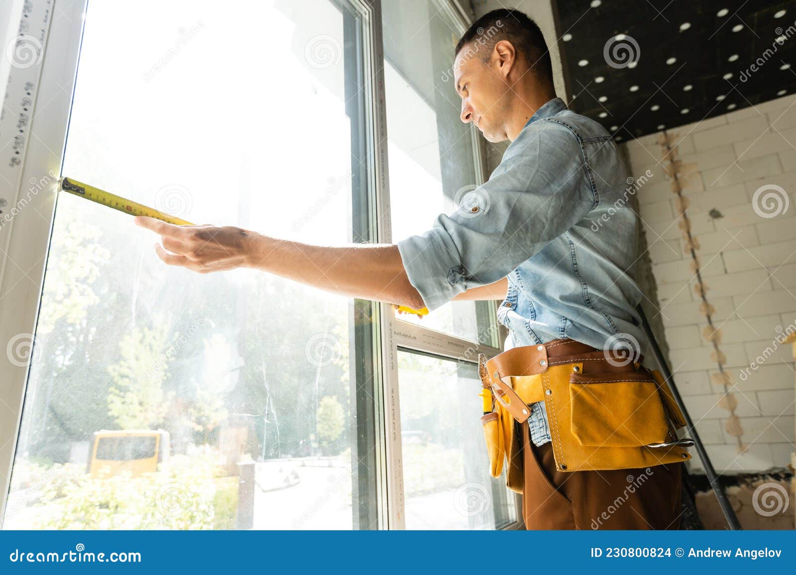 Construction Worker Installing Window in House Stock Photo - Image of ...