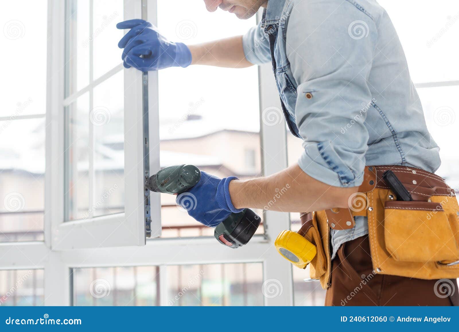 Construction Worker Installing Window in House. Handyman Fixing the ...