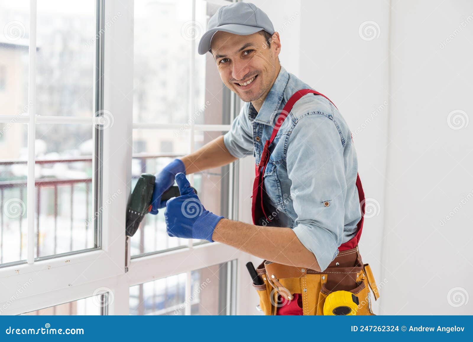 Construction Worker Installing Window in House. Handyman Fixing the ...