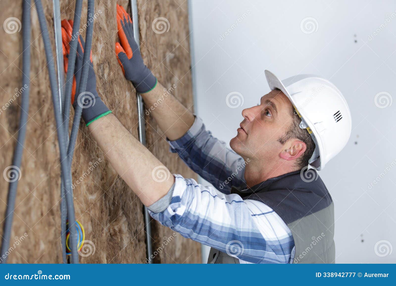 Construction Worker Insulating Brick Wall with Glass Wool Stock Image ...