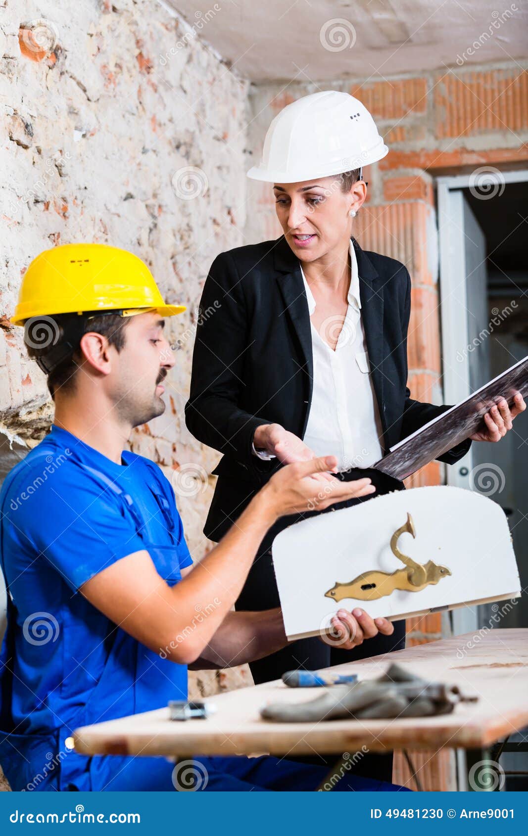 Construction Worker and Interior Designer with Door Stock Photo - Image ...