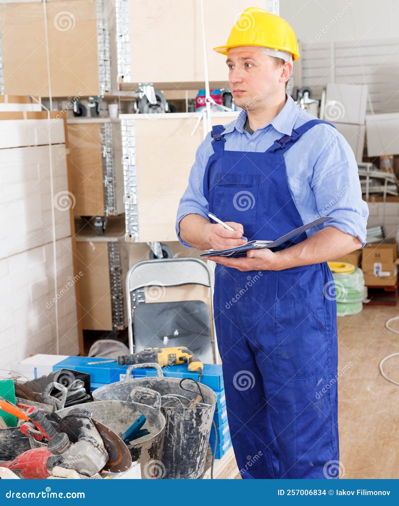 Construction Worker Inventorying Tools and Materials Stock Photo ...