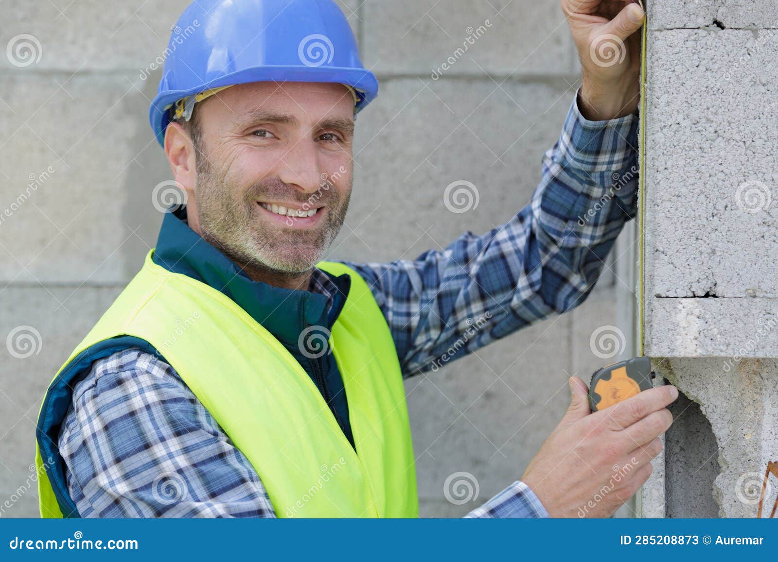 Construction Worker Laying Bricks and Using Measuring Tape Stock Image ...