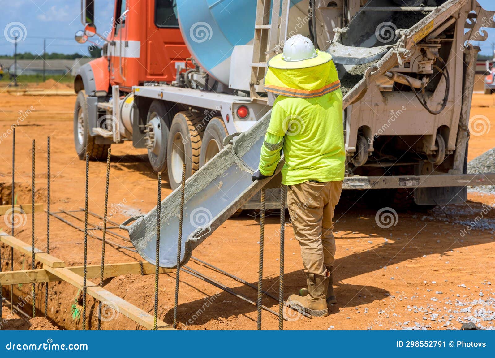Construction Worker Laying Cement Concrete in Trenches for Building a ...