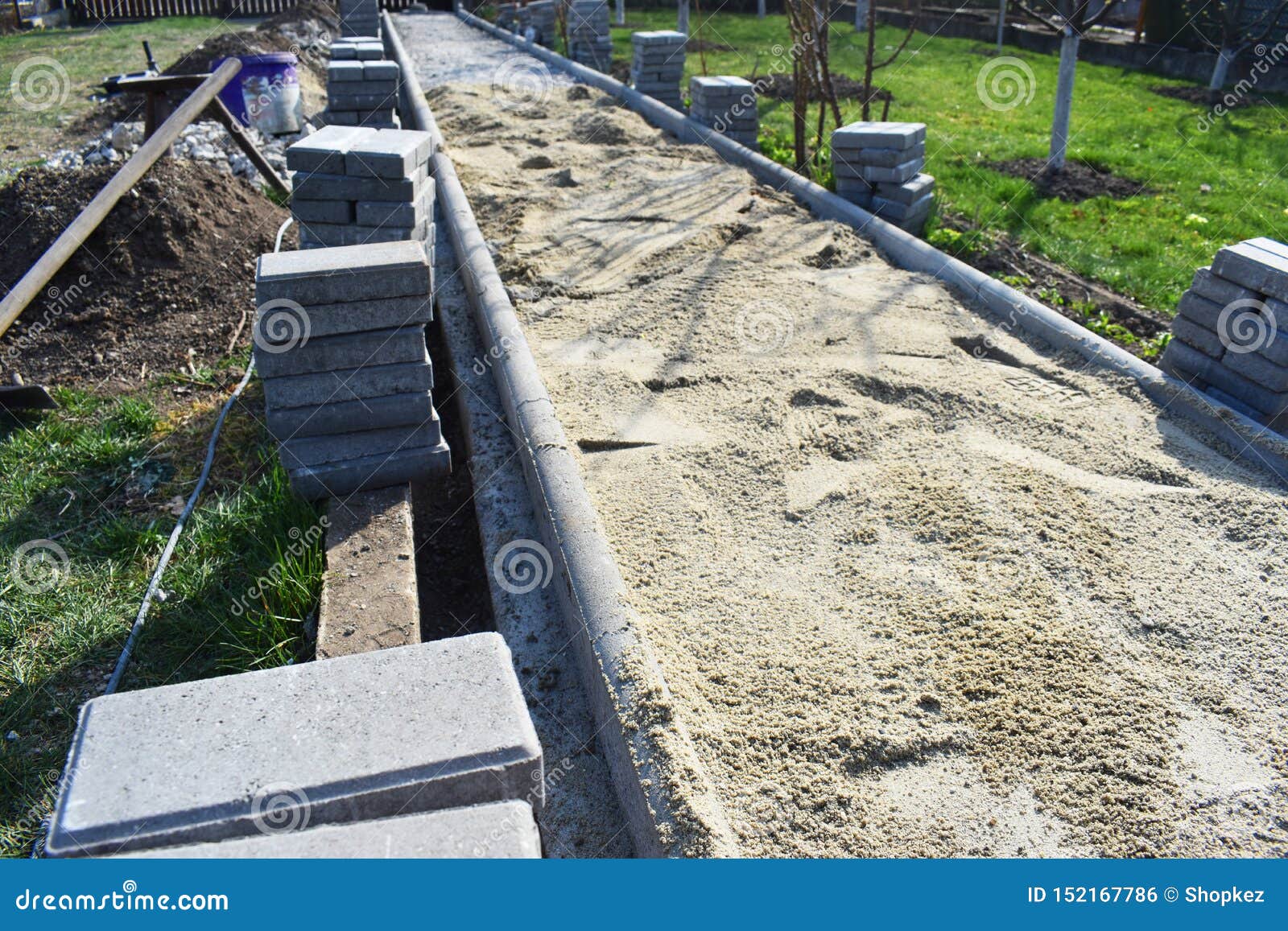 Construction Worker are Laying Concrete Pavement Stone for Footpath ...