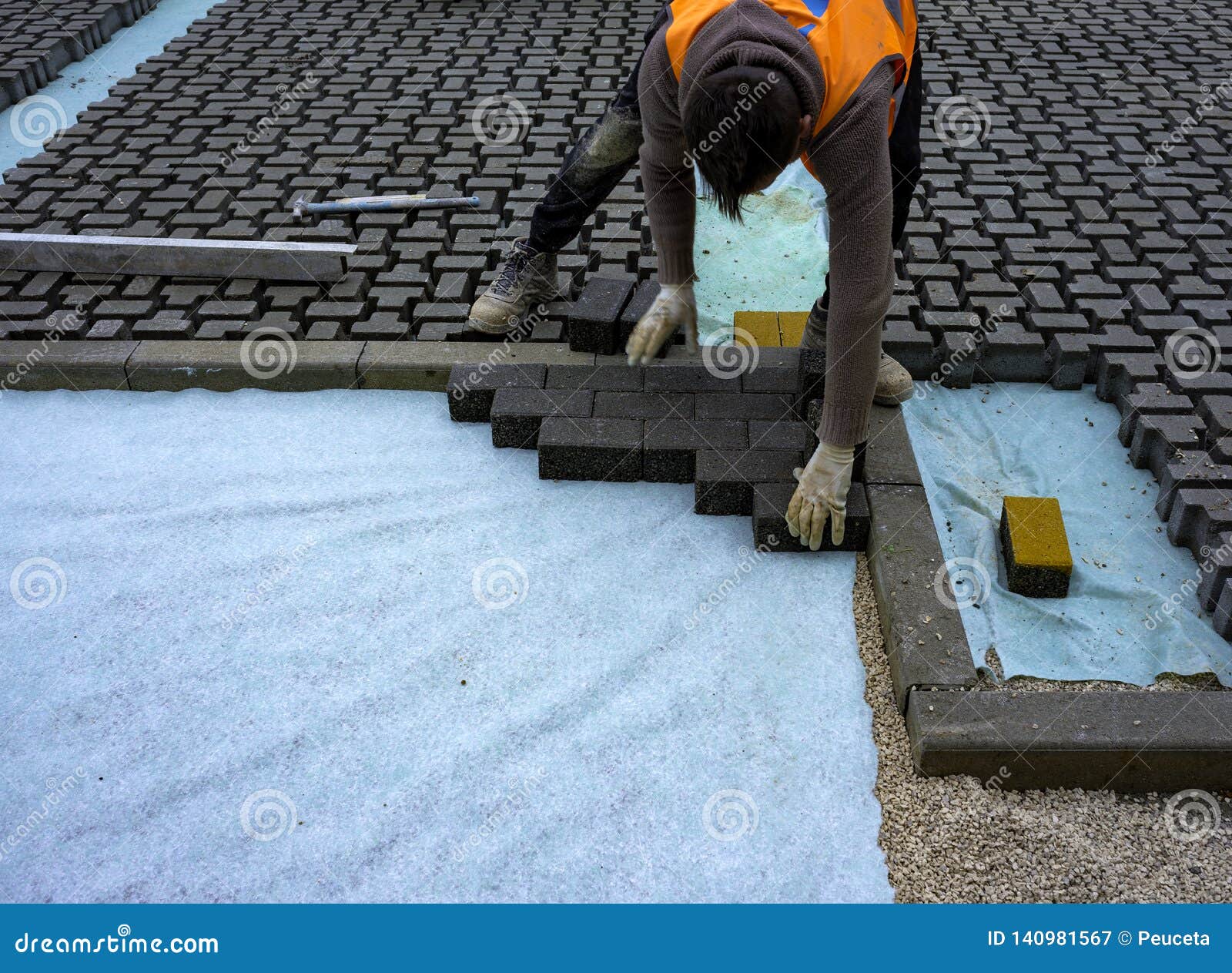 Construction Worker Laying Interlocking Paving Concrete Stock Image ...