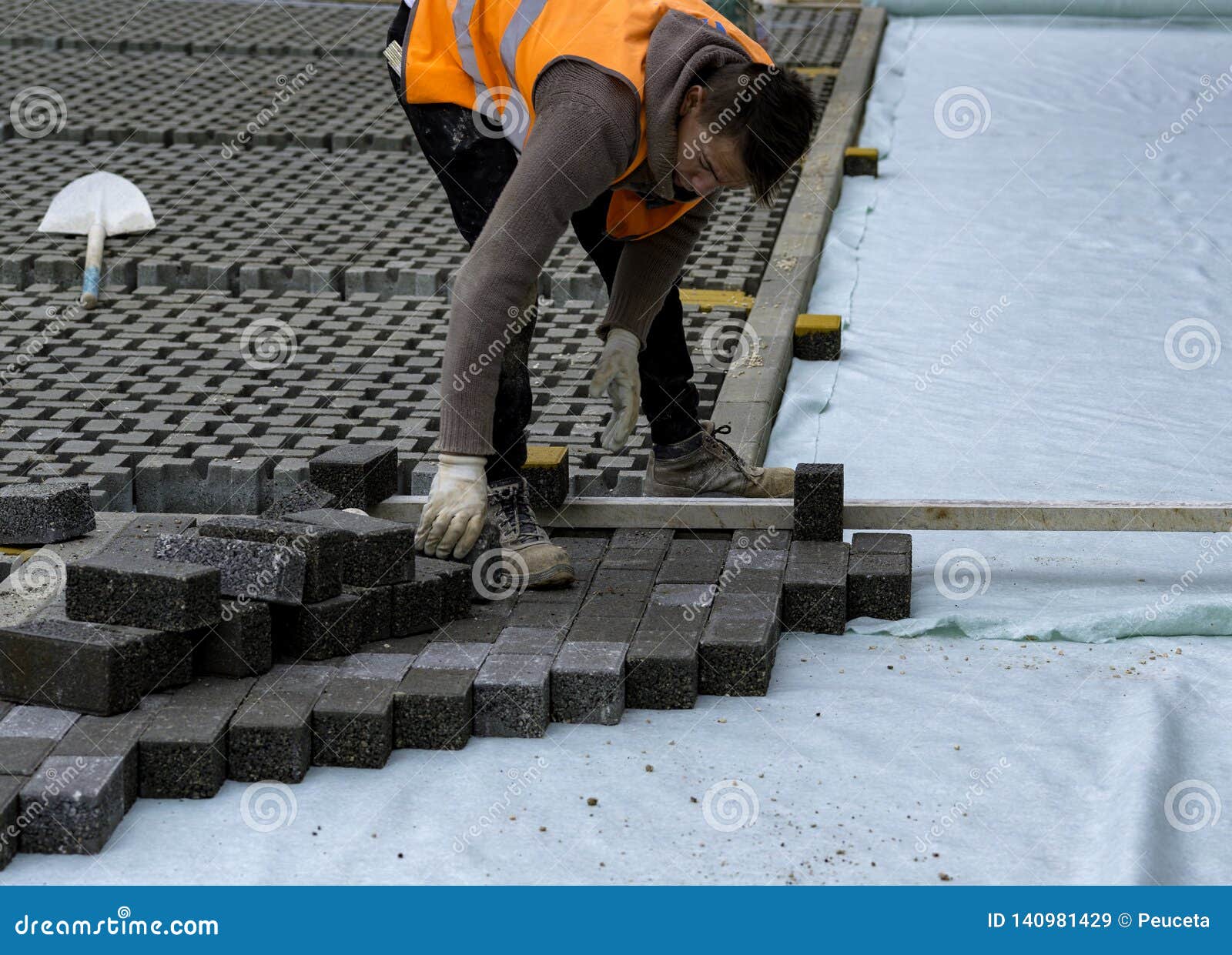 Construction Worker Laying Interlocking Paving Concrete Stock Image ...