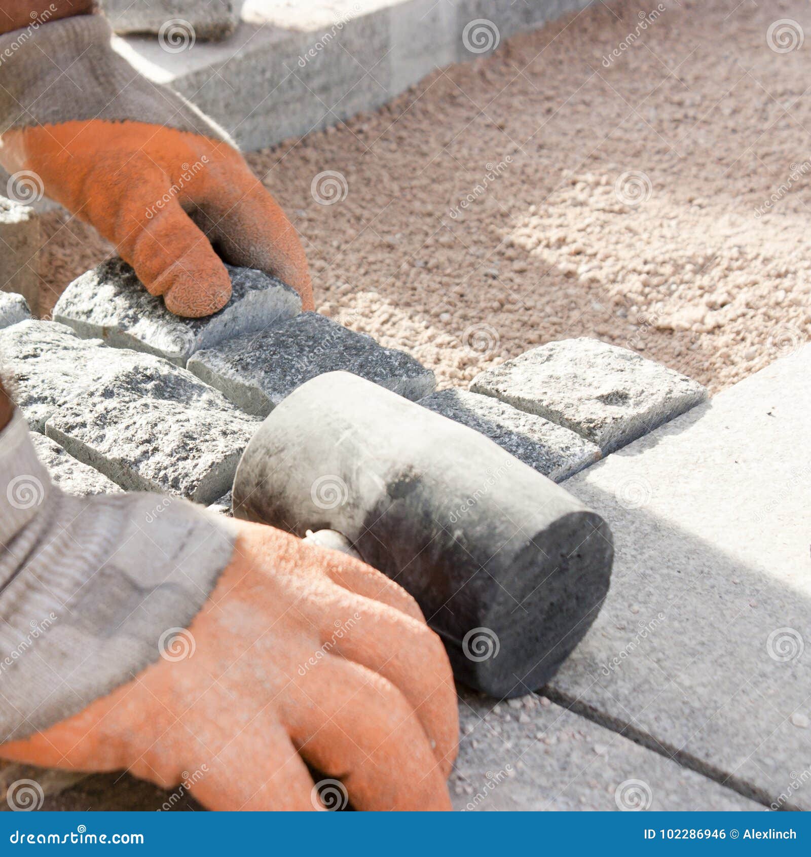 Construction Worker Laying Stone Cobbles in Sand Stock Photo - Image of ...
