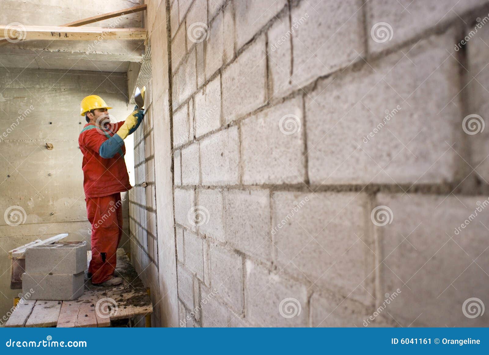 Man Builds Cinder Block Wall - Vertical Royalty-Free Stock Image ...