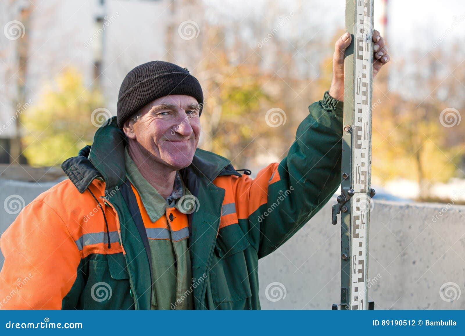 Construction Worker with Leveling Rod Stock Photo - Image of land ...