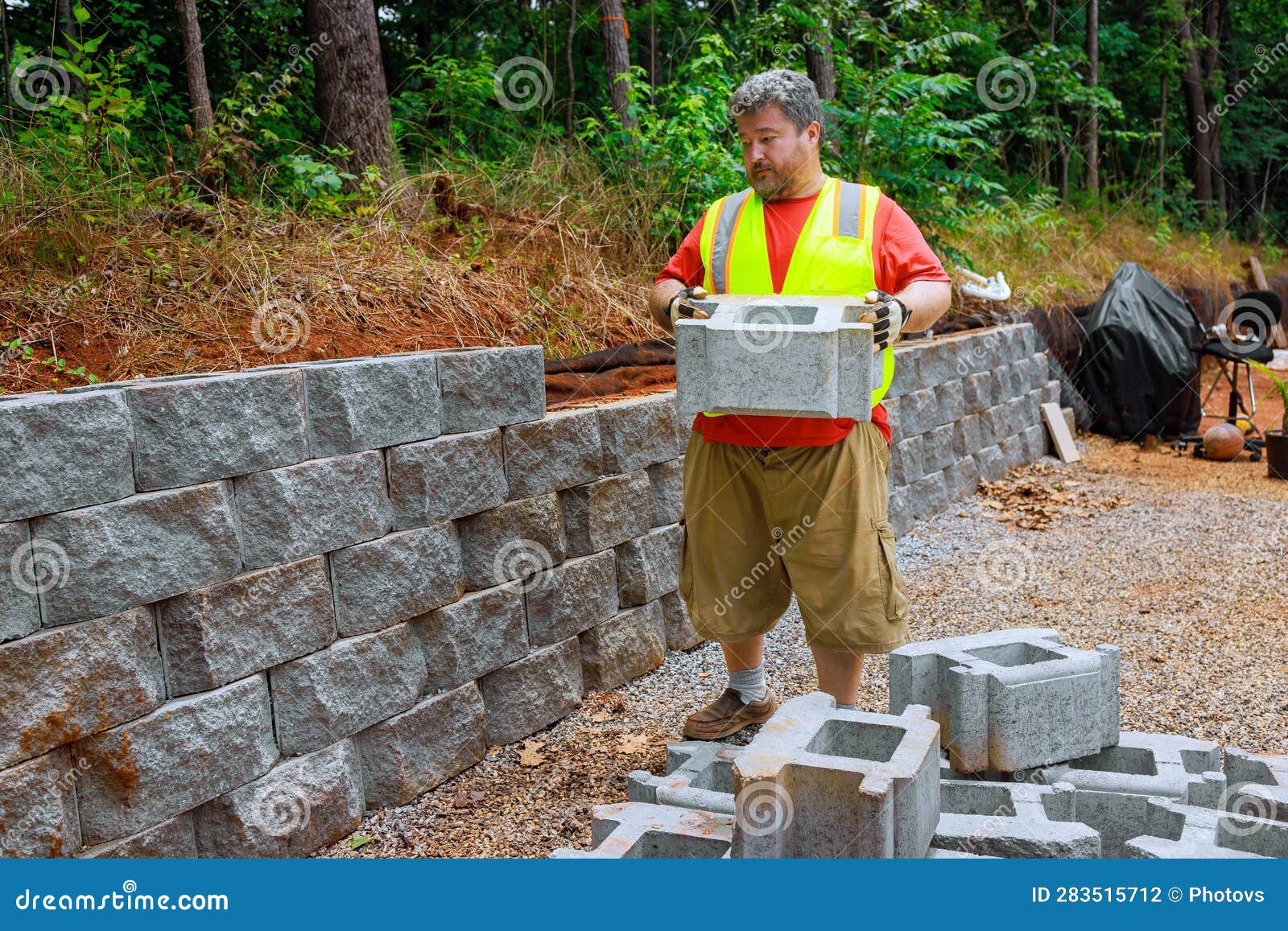 Construction Worker Lifted Concrete Block from Ground and Placed it on ...