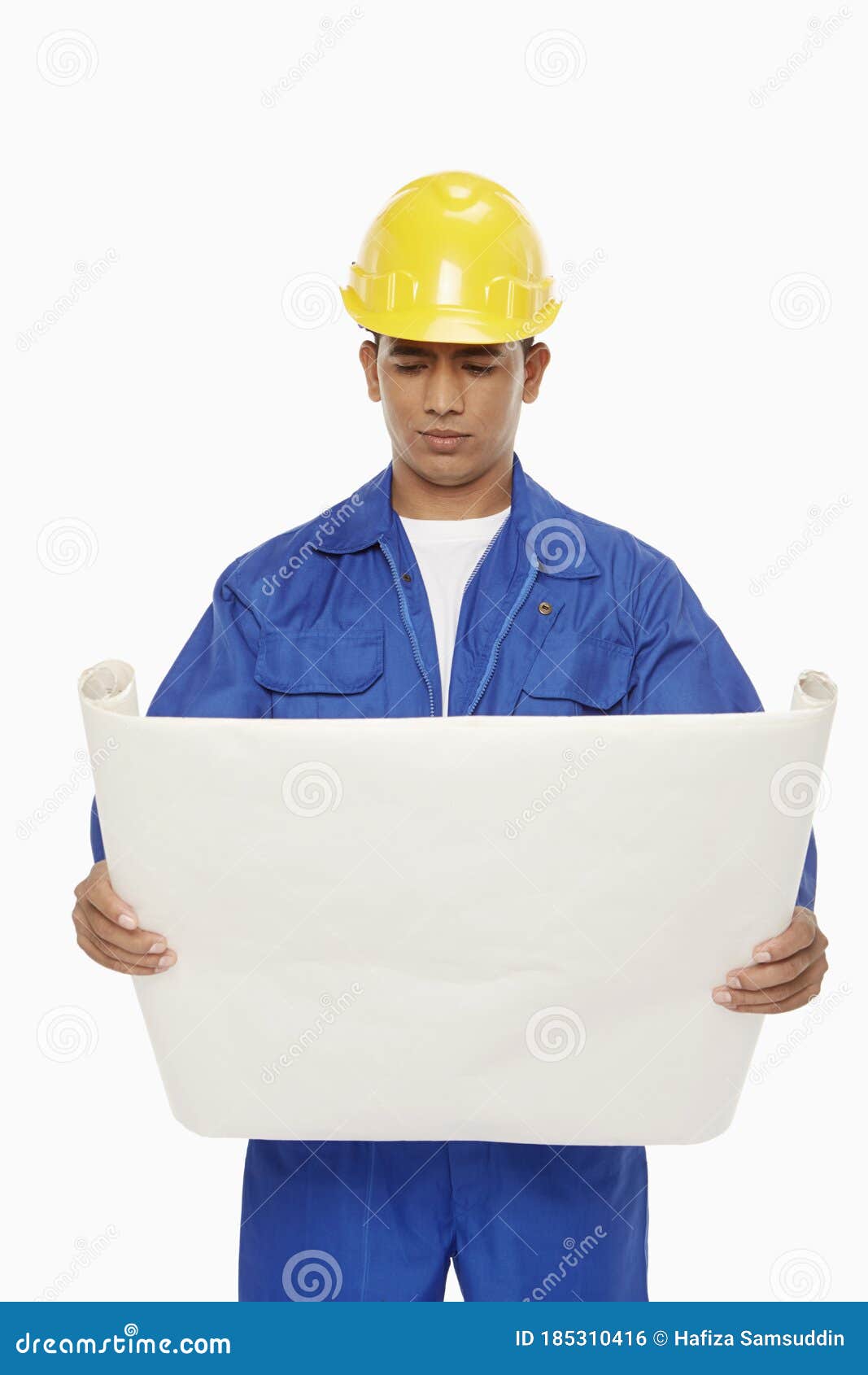Construction Worker Looking at a Blueprint Plan Stock Photo - Image of ...