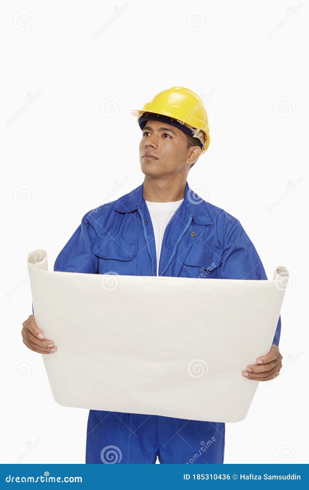 Construction Worker Looking at a Blueprint Plan Stock Photo - Image of ...
