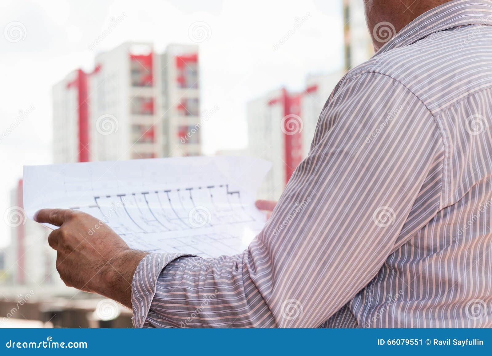 A Construction Worker Man Holding in Hands Blueprints Stock Image ...