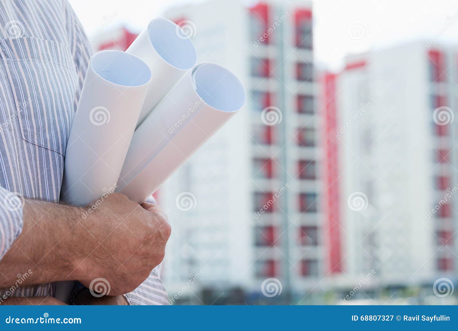 A Construction Worker Man Holding in Hands Blueprints Stock Image ...