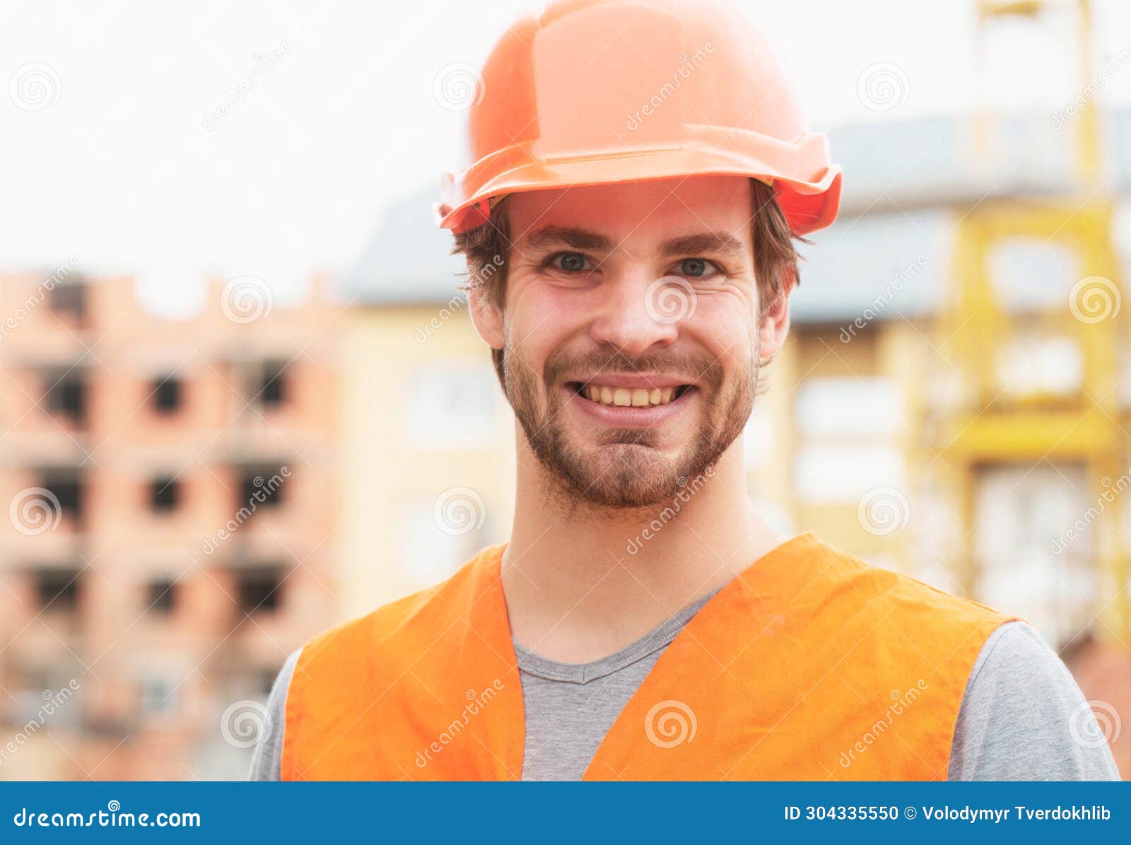 Construction Worker Man in Work Clothes and a Construction Helmet ...