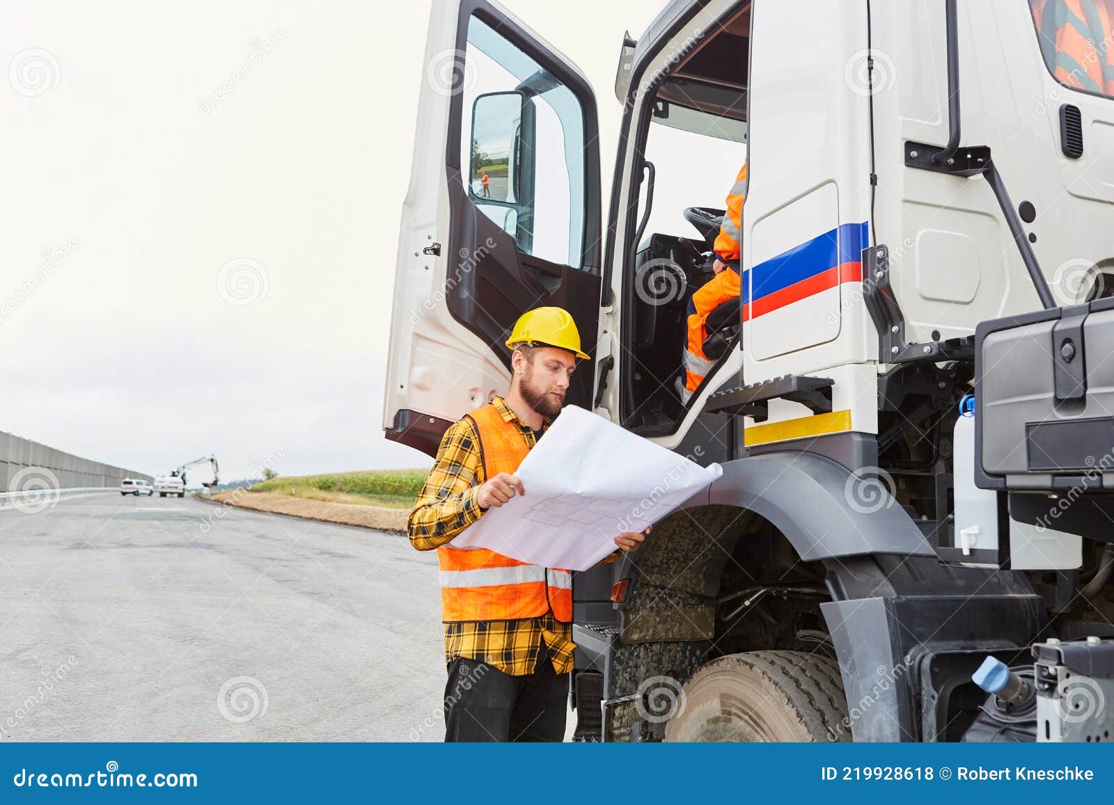 Construction Worker with a Map in Front of a Truck Stock Photo - Image ...