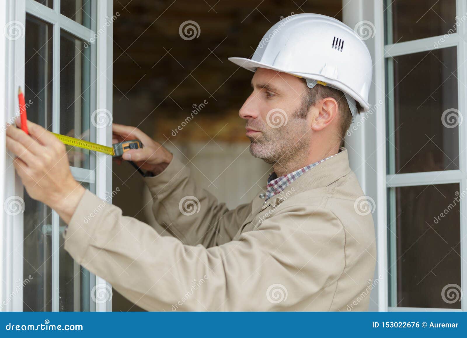 Construction Worker Measures Window Frame Stock Photo - Image of ...