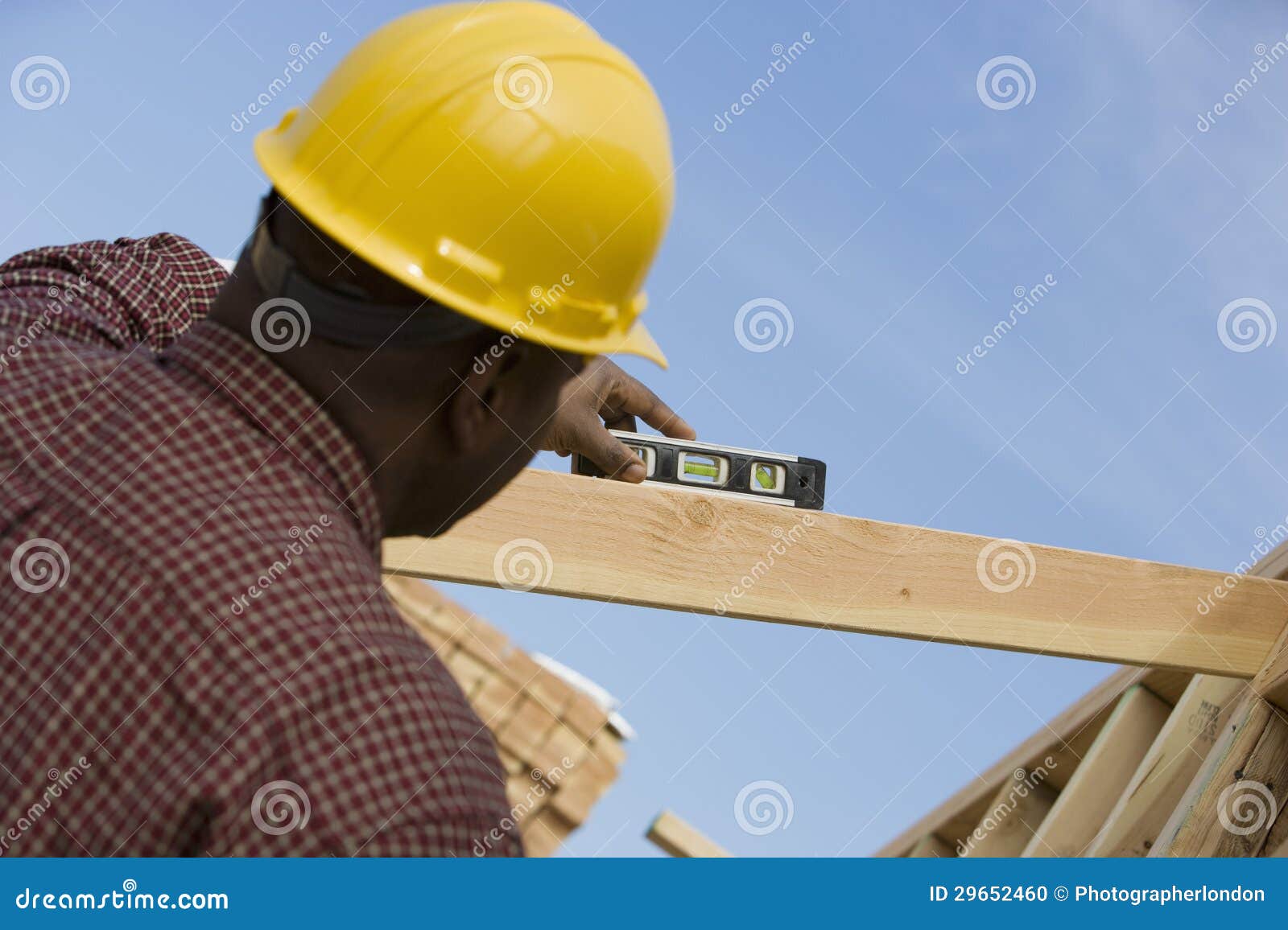 Construction Worker Measuring Level Stock Photo - Image of ethnicity ...
