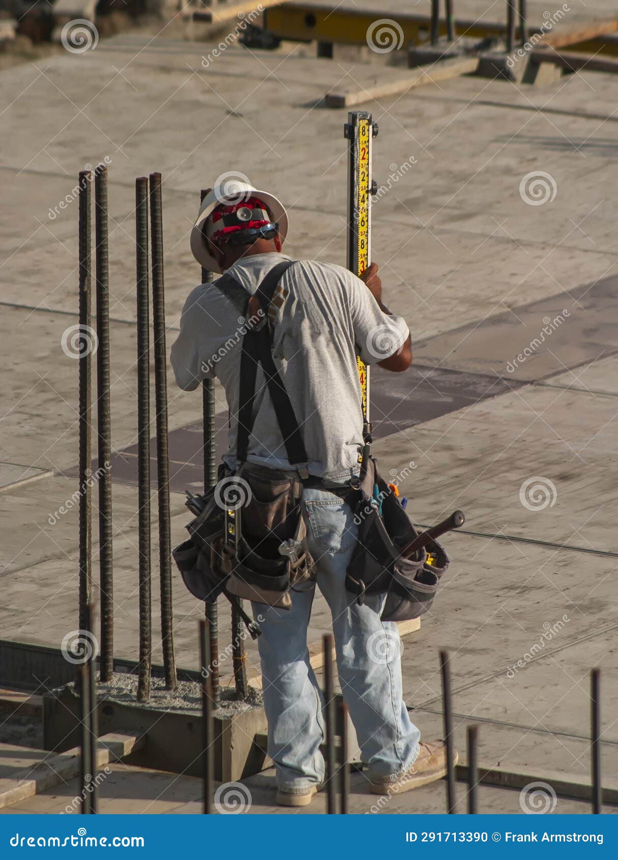 Construction Worker Measuring Rebar at a Construction Site Stock Photo ...