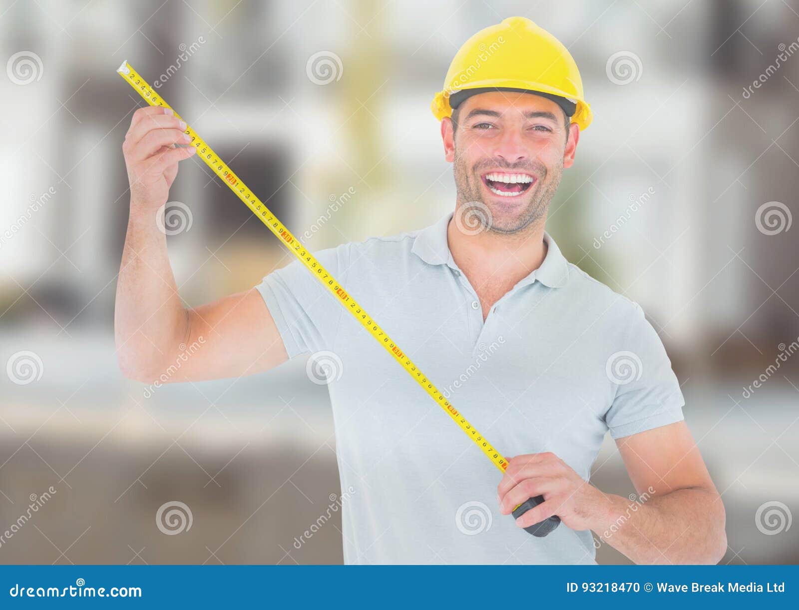 Construction Worker with Measuring Tape in Front of Construction Site ...