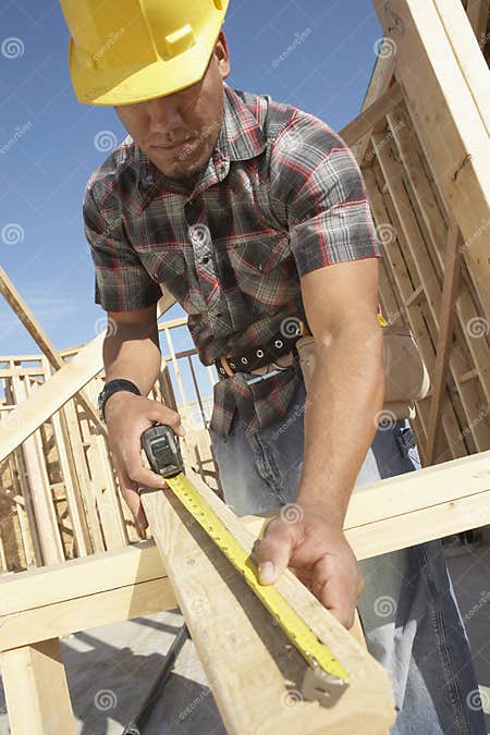 Construction Worker Measuring Timber Stock Image - Image of crew, hands ...