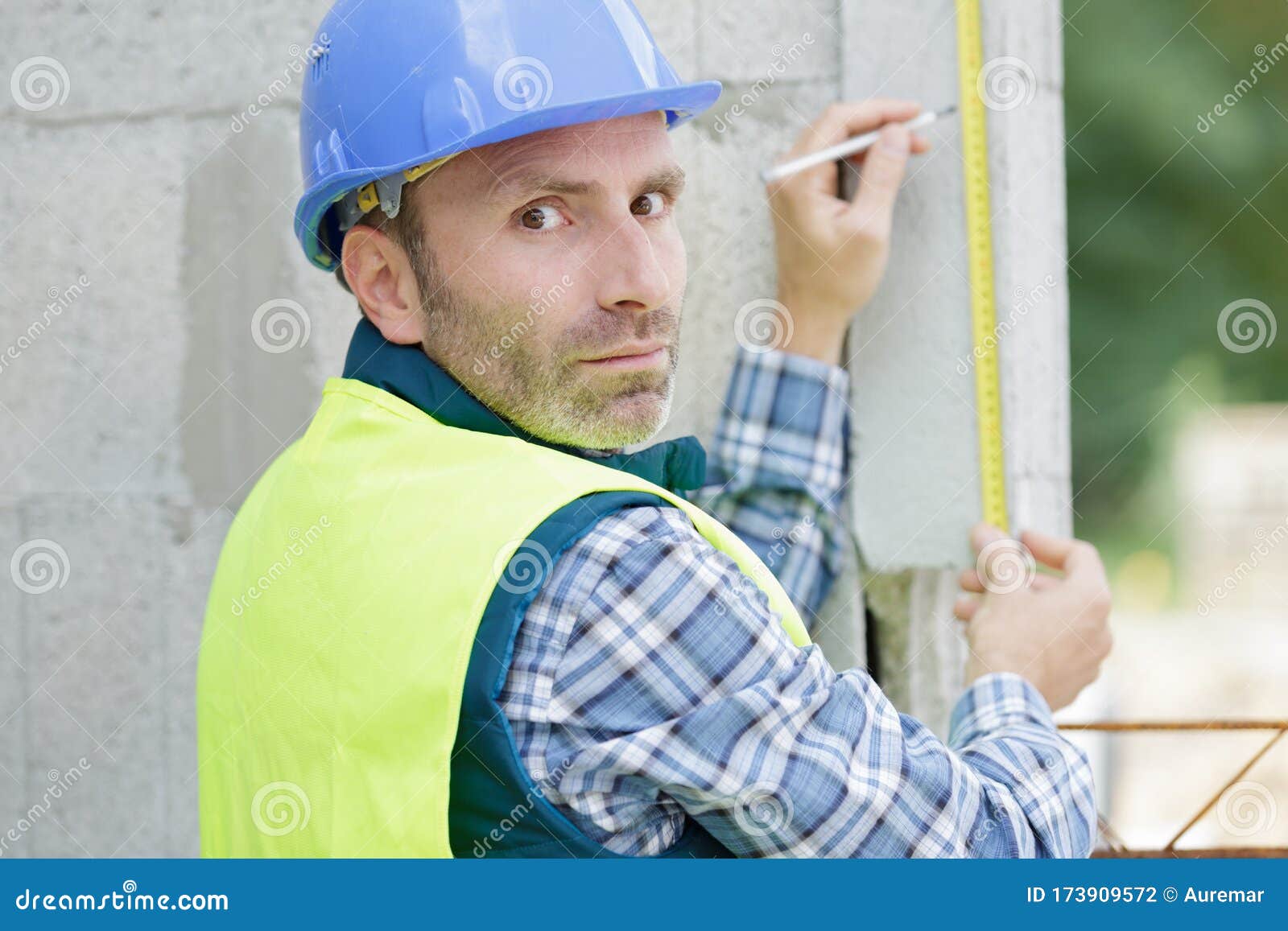 Construction Worker with Measuring Tool Stock Photo - Image of ...