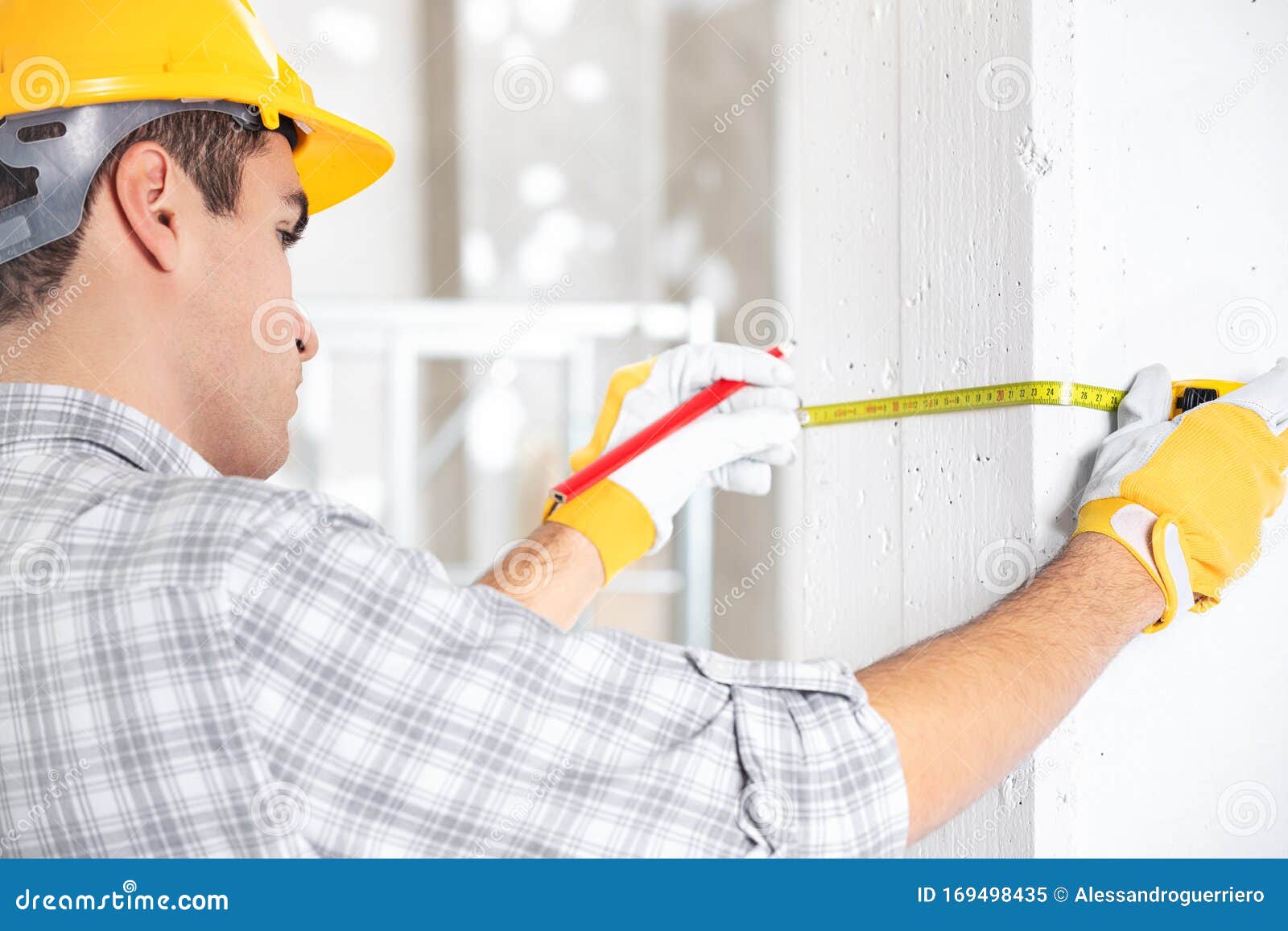 Construction Worker Measuring the Wall Stock Image - Image of goggles ...