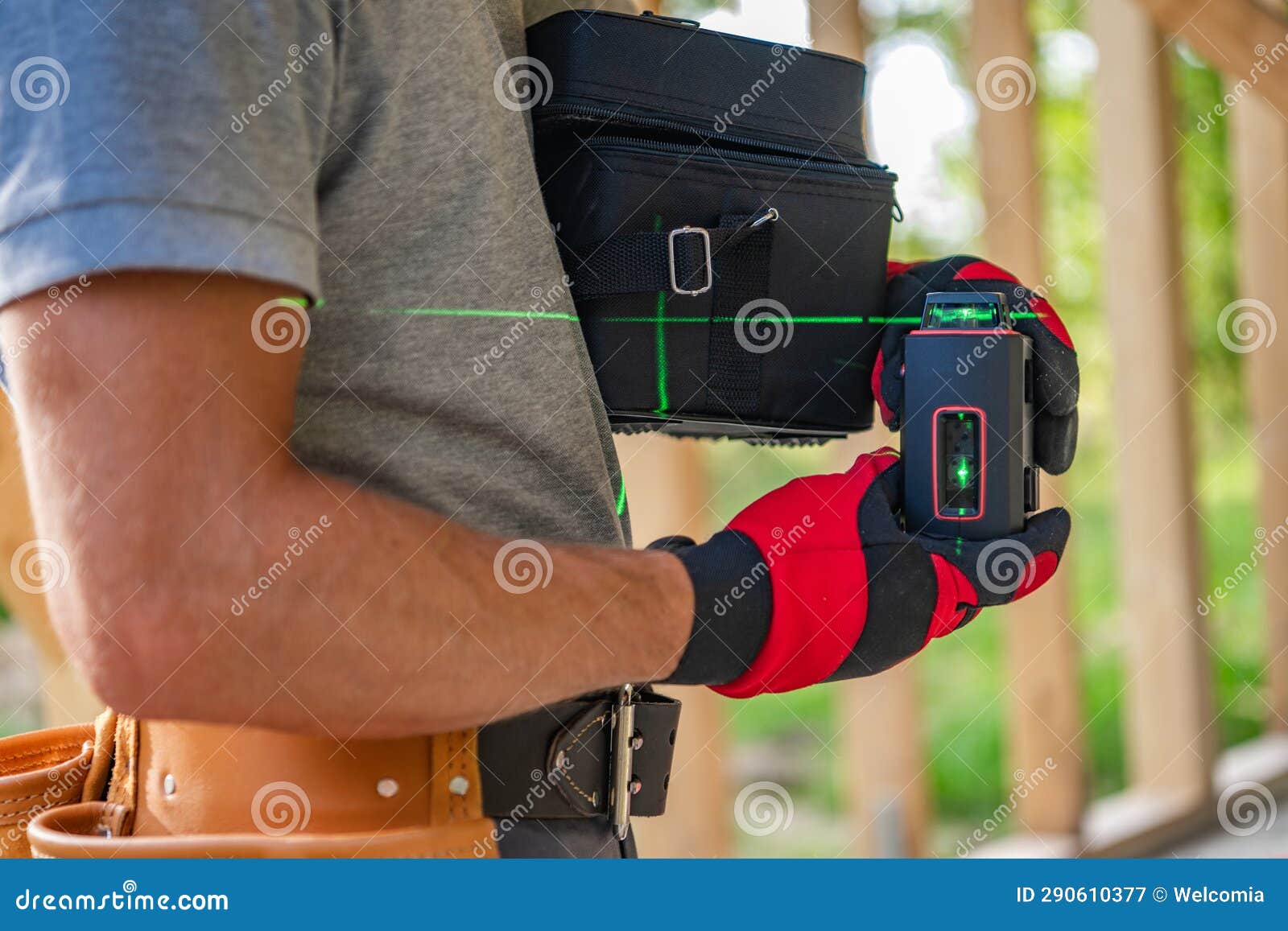 Construction Worker with Modern Laser Leveling Tool in His Hands Stock ...