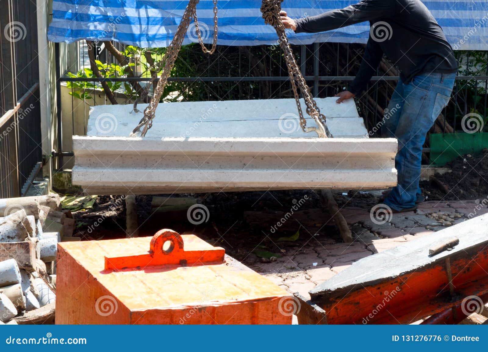 Construction Worker Move Concrete Stake Stock Photo - Image of ...