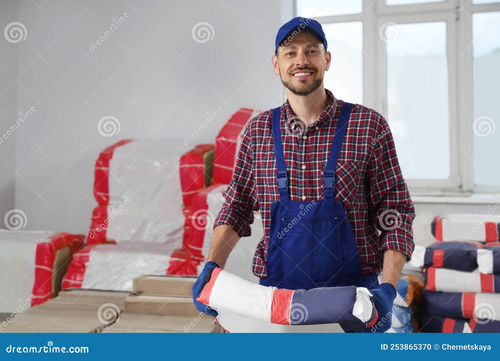 Construction Worker with New Building Materials in Room Prepared for ...