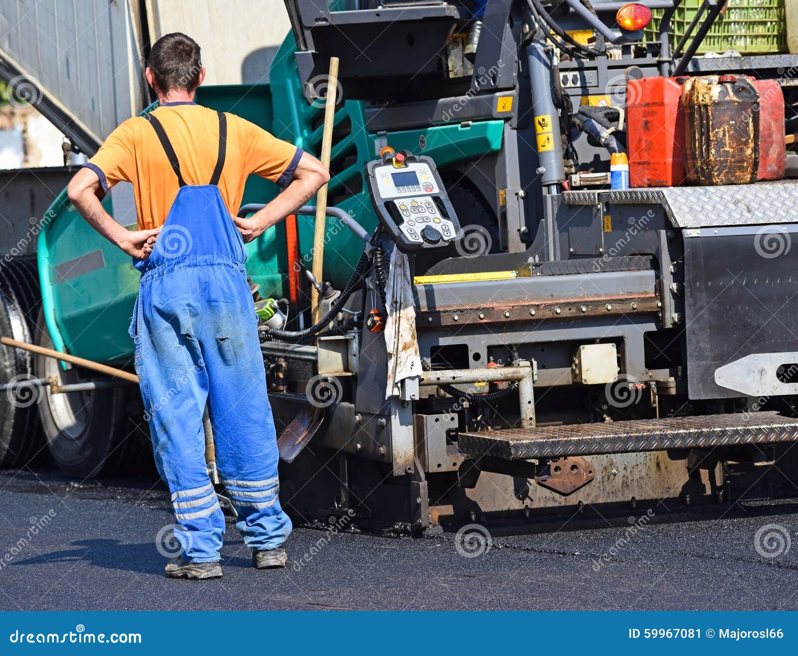 Construction Worker Next To an Asphalt Paving Vehicle Editorial Photo ...