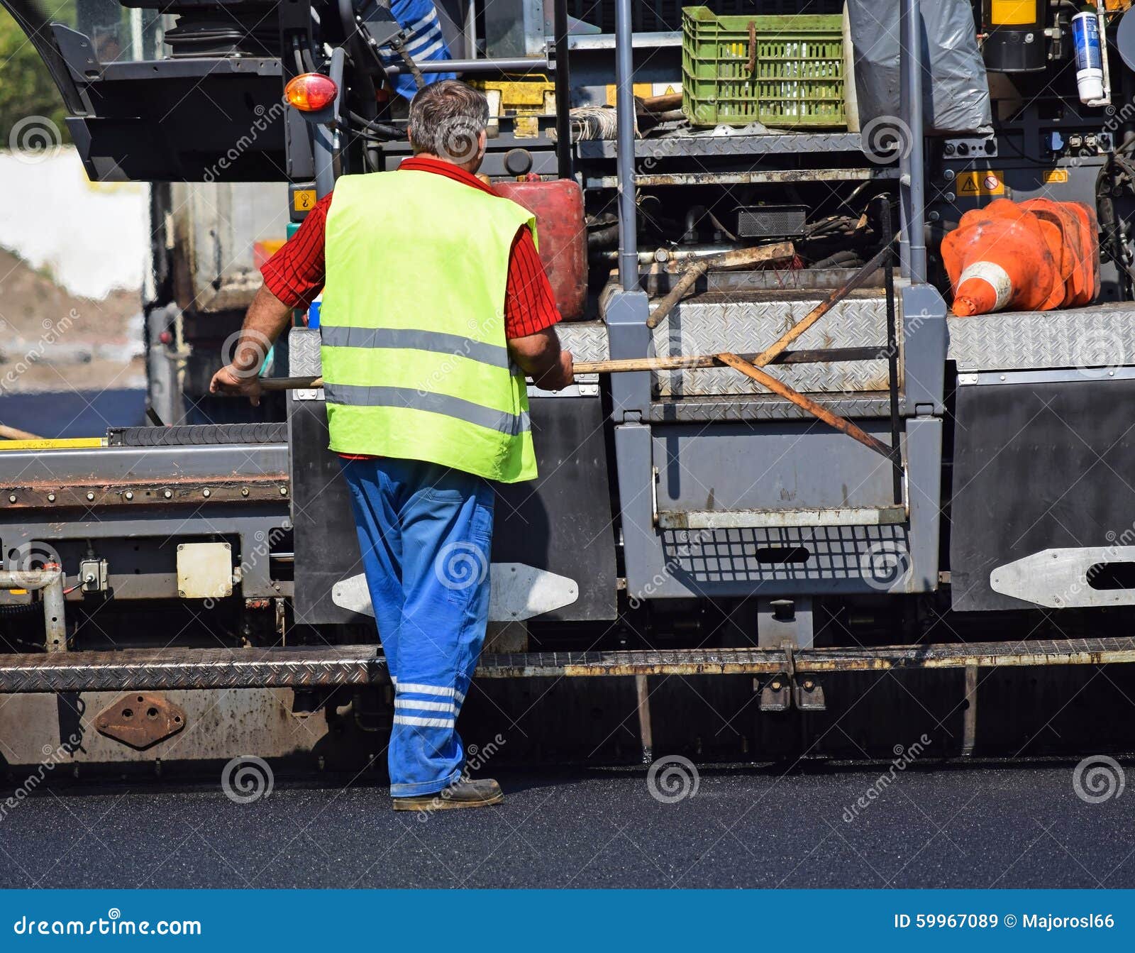 Construction Worker Next To an Asphalt Paving Vehicle Editorial Stock ...